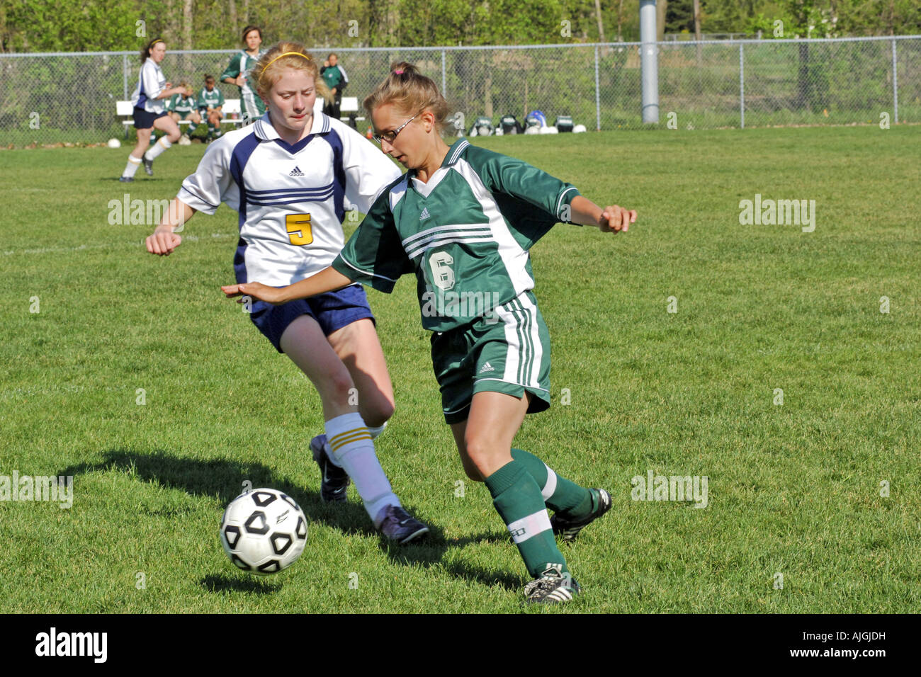 Teenage girls involved in High School Soccer action Stock Photo - Alamy