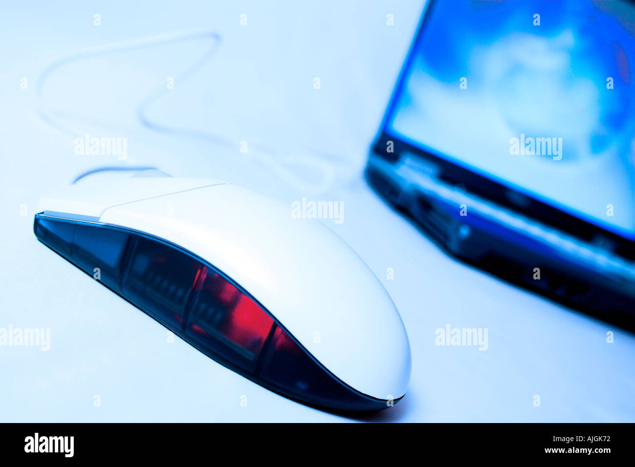 Laptop and mouse Stock Photo - Alamy