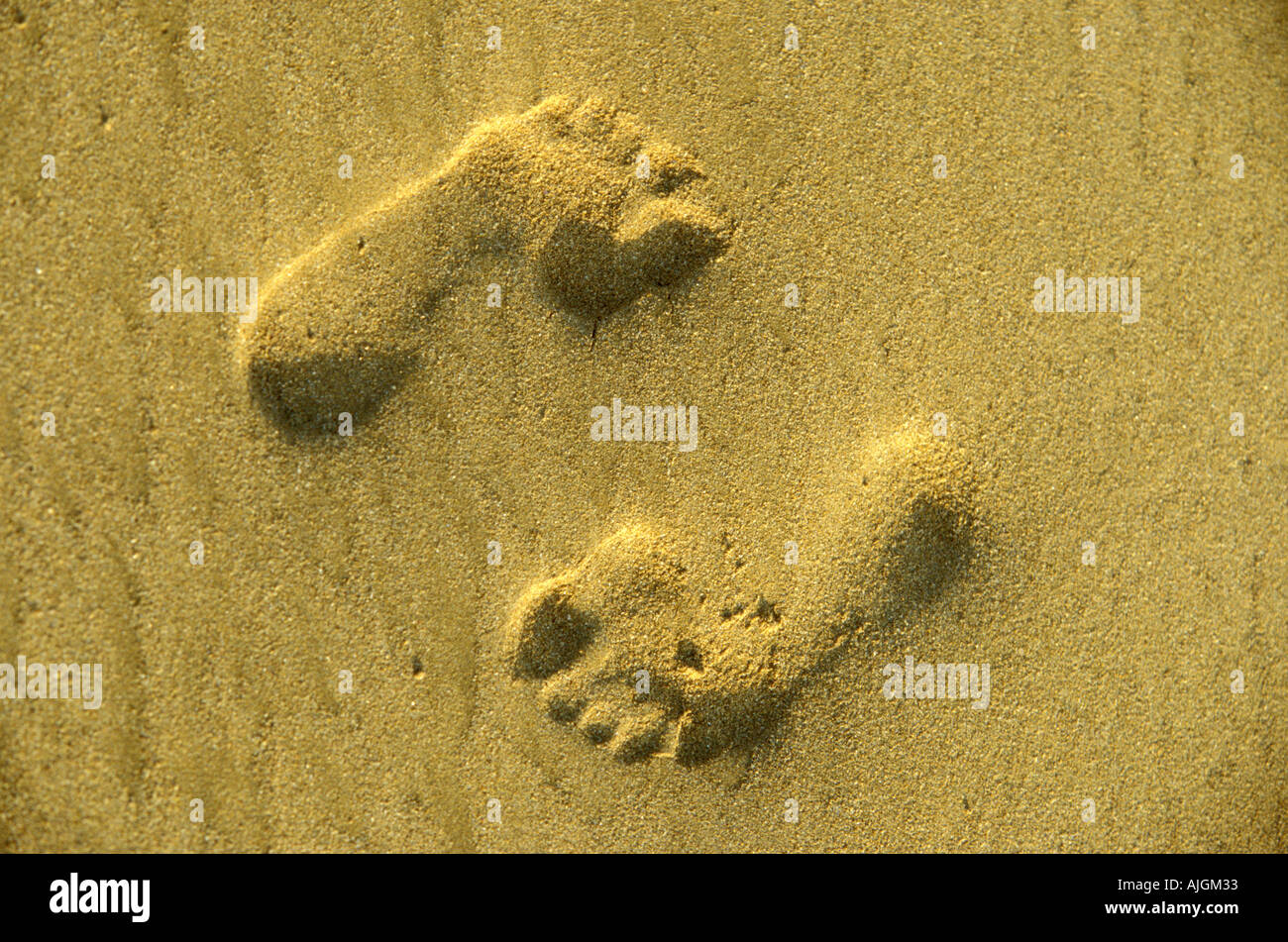 Pair footprints in sand hi-res stock photography and images - Alamy