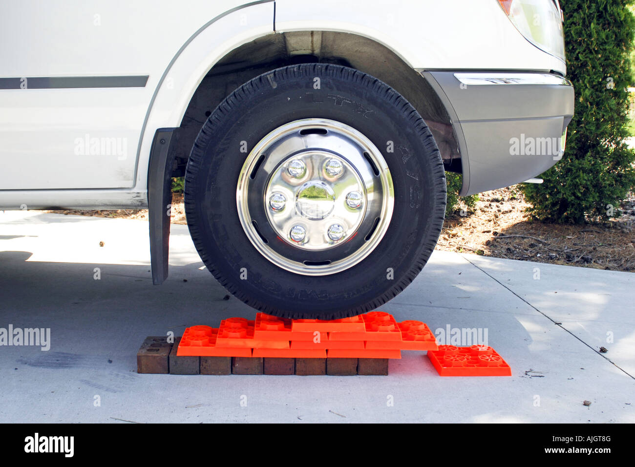 Motor home on levelling blocks whilst static on a sloping driveway ...