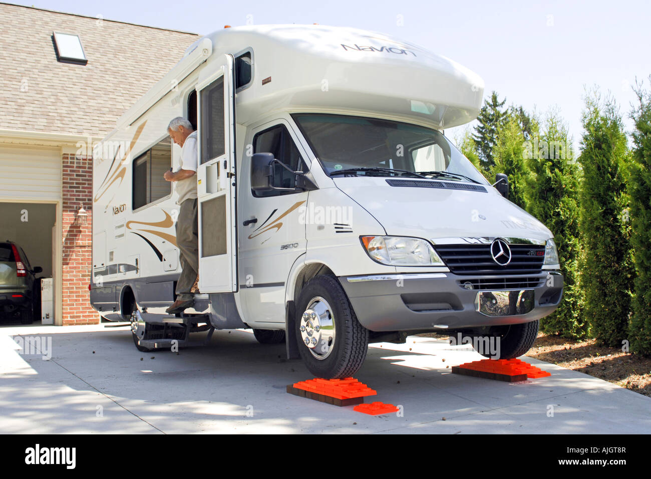 Motor home on levelling blocks whilst static on a sloping driveway ...