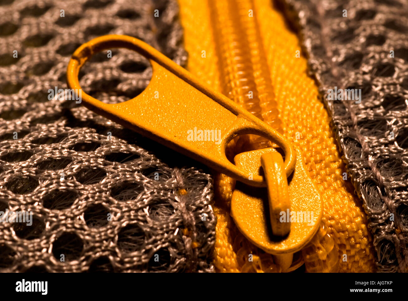 close up of a yellow zip Stock Photo - Alamy