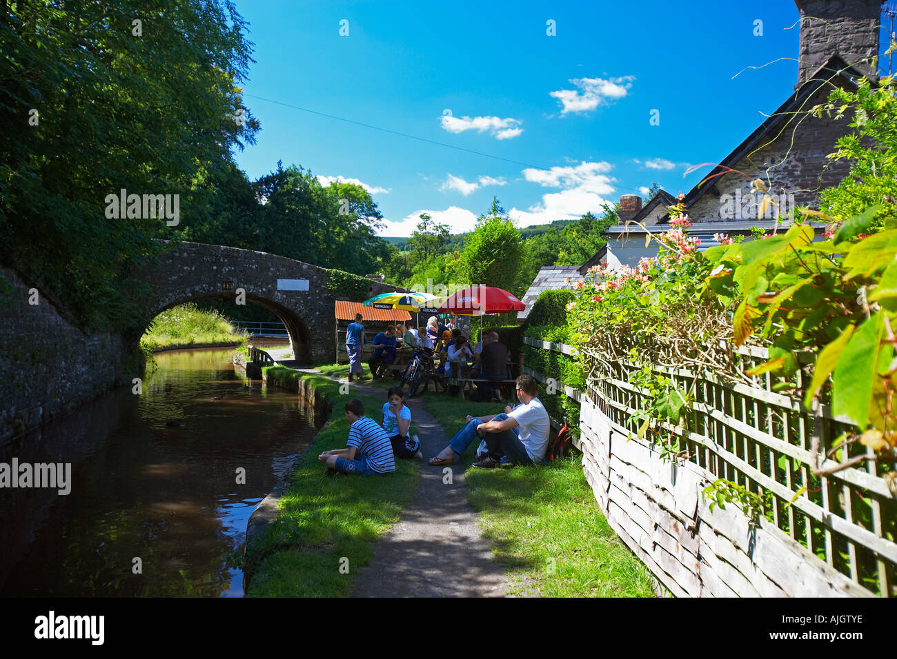 Family relaxing by a Pub on the Brecon and Monmouth Canal South Wales ...