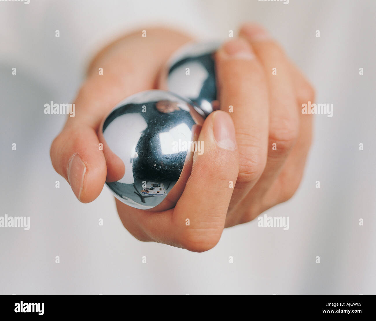 Close up of metal balls in a man s hand Stock Photo - Alamy