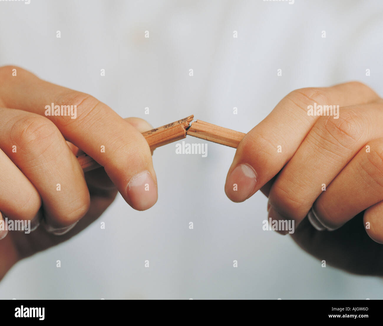 Hands breaking pencil hi-res stock photography and images - Alamy
