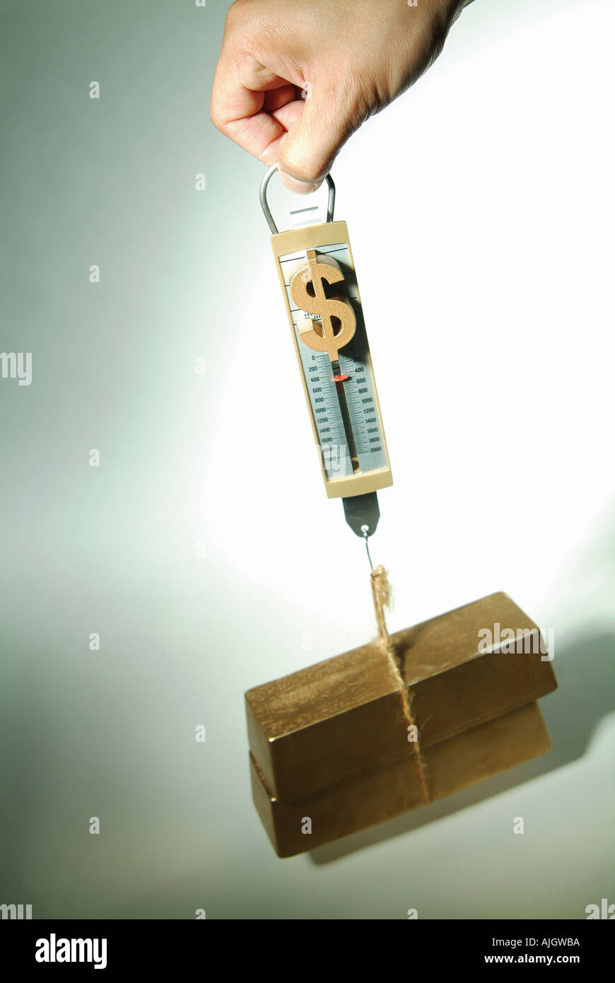 High angle view of gold bricks hanging from a weighing scale Stock ...