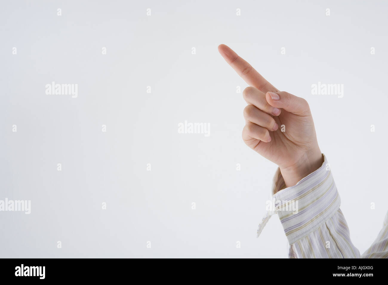 Woman's hand holding up one finger Stock Photo - Alamy
