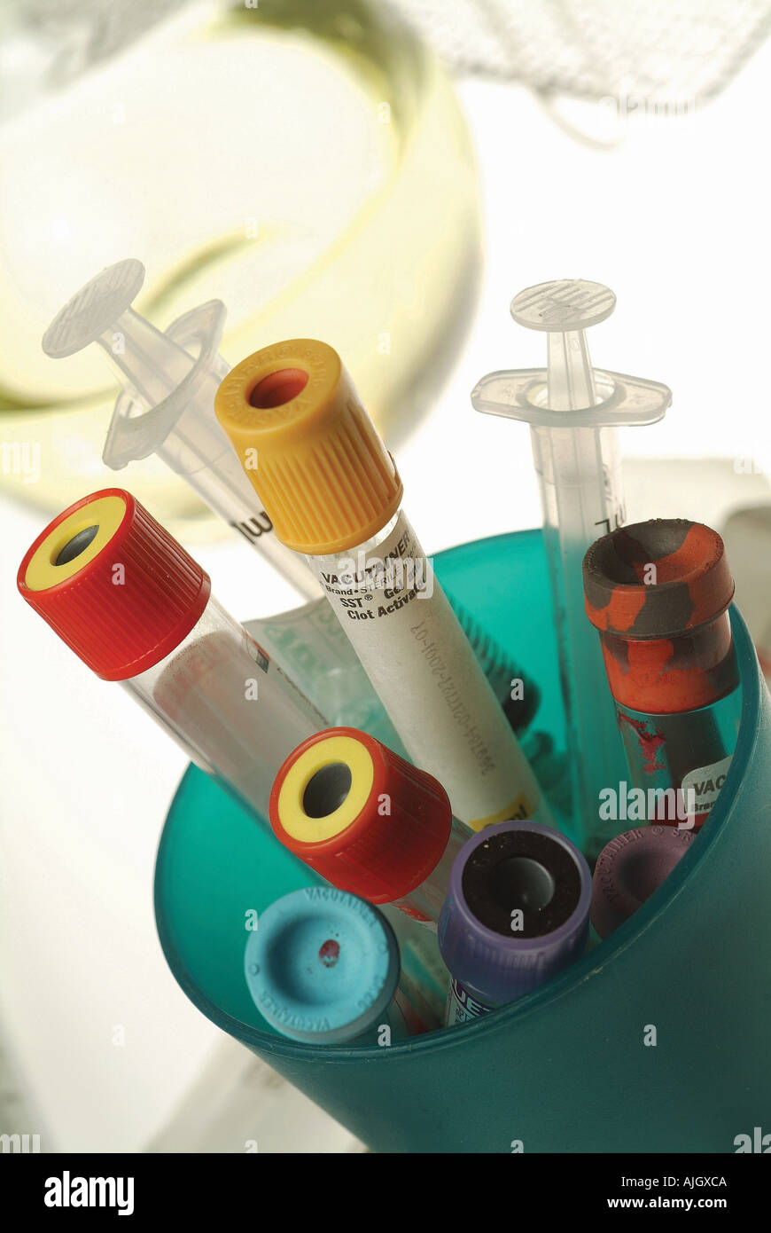 High angle view of test tubes and syringes in a holder Stock Photo - Alamy