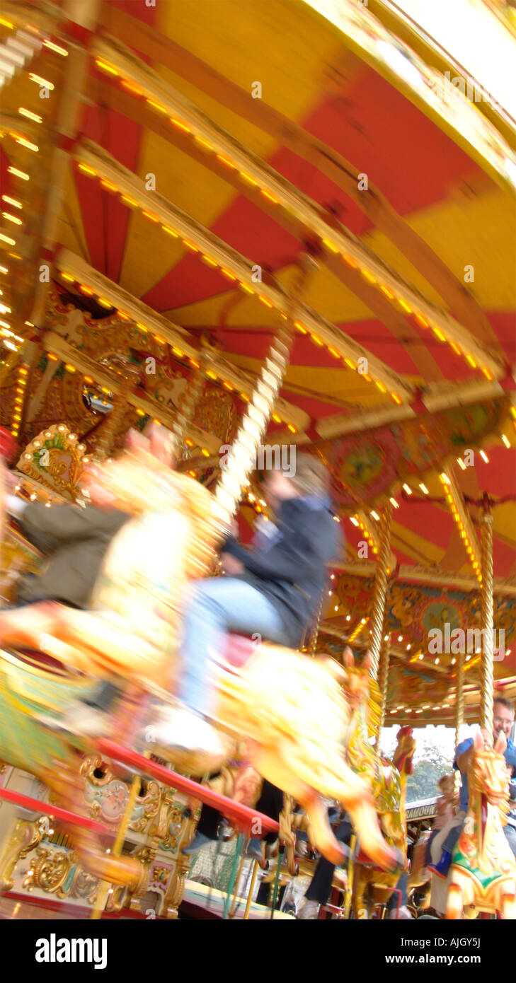 Carousel Merry go round blurr Stock Photo - Alamy