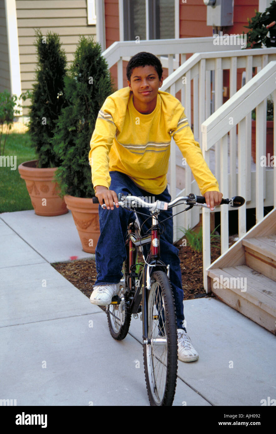 Teen boy riding his bike Stock Photo - Alamy