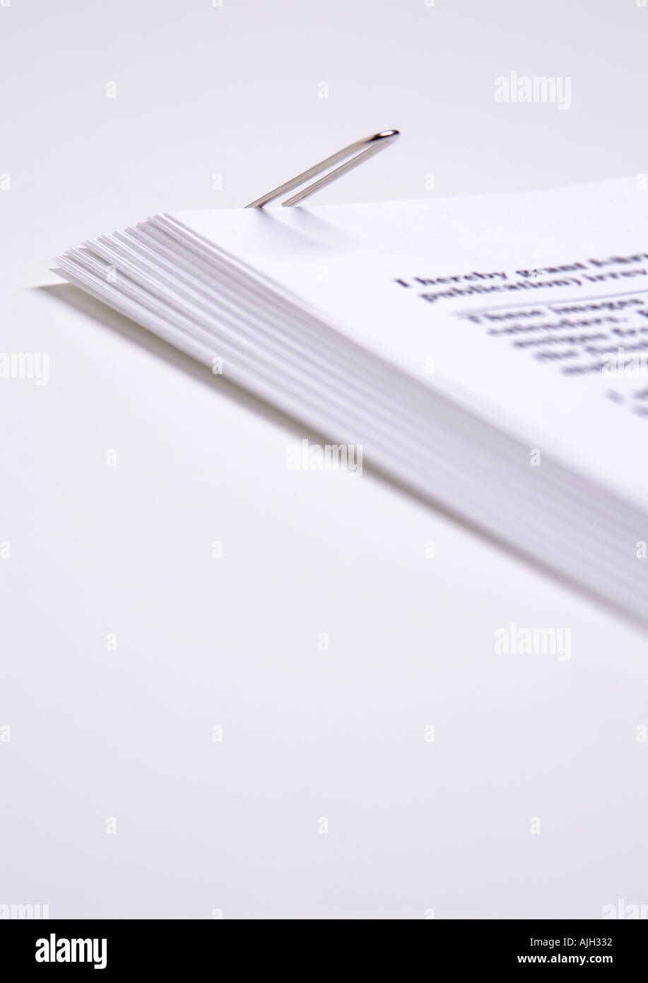 bent paper clip with paper Stock Photo - Alamy