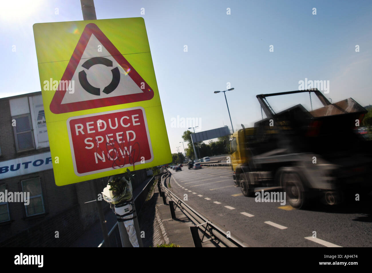 Reduce Speed Now Sign Stock Photo - Alamy