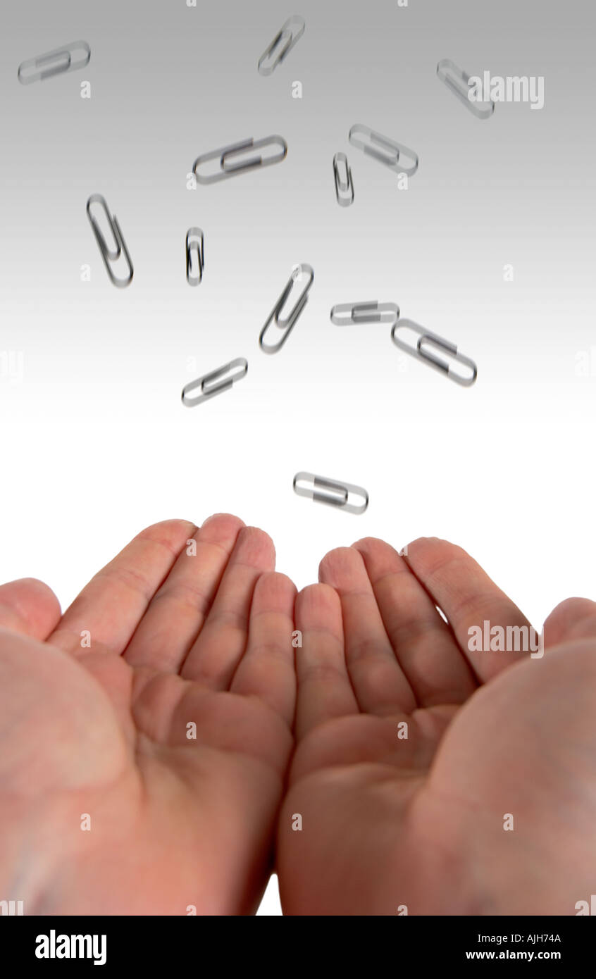 hand catching falling paper clips Stock Photo - Alamy