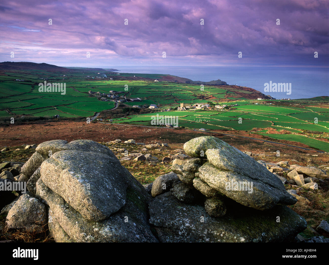 The Logan Stone in fore-ground, coastal strip & sea beyond, Zennor ...