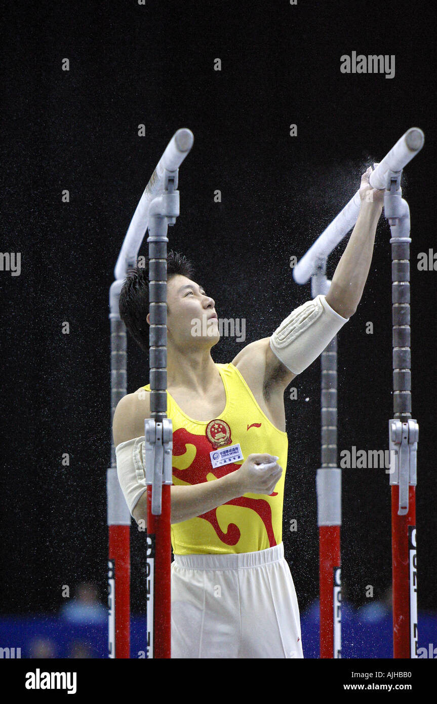 Xu Huang Chinese gymnast prepares for his performance on parallel bars ...