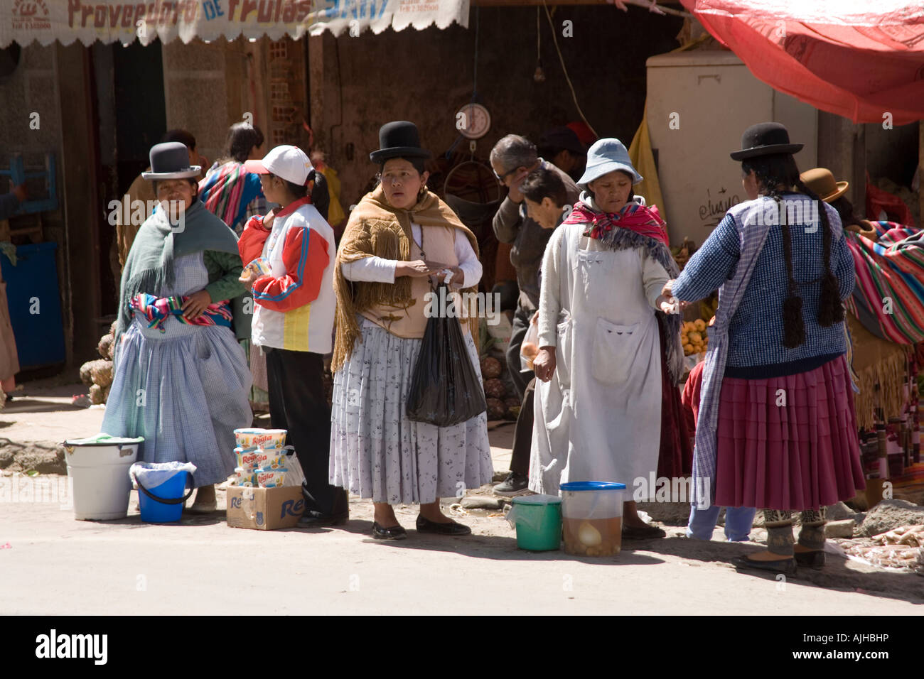 Aymara people and a food stall in the market district of La Paz ...