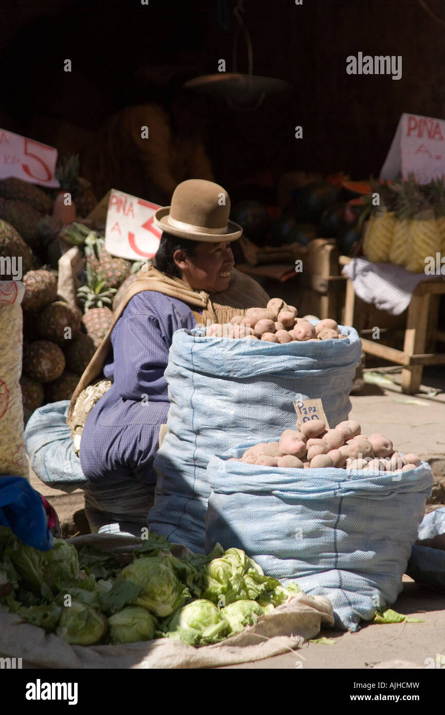 Aymara people and a food stall in the market district of La Paz ...
