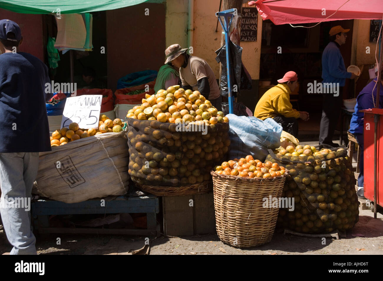 Aymara people and a food stall in the market district of La Paz ...