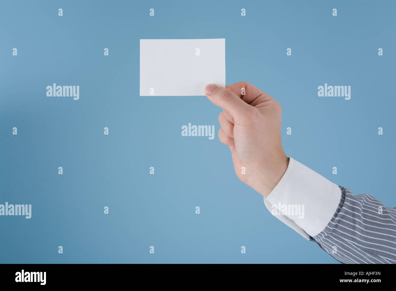 Hand holding card Stock Photo - Alamy