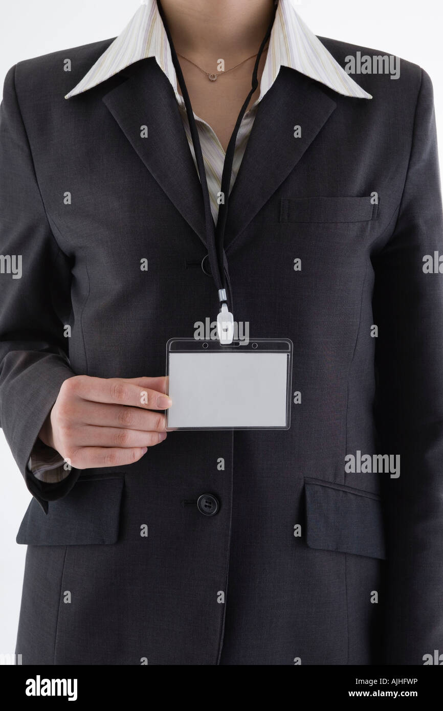 Businesswoman wearing ID card Stock Photo - Alamy