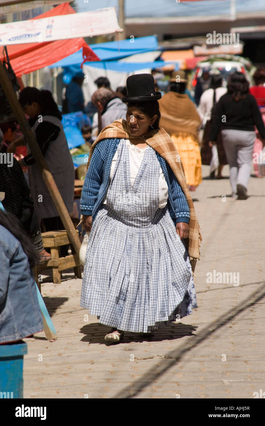 Aymara people and a food stall in the market district of La Paz ...