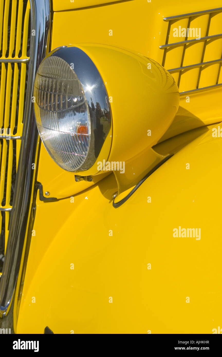 headlamp on yellow hotrod Stock Photo - Alamy
