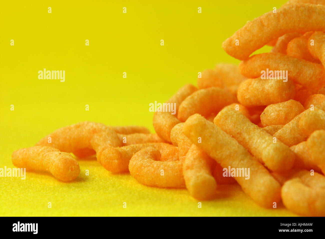 potato snacks closeup with yellow background food concepts Stock Photo ...