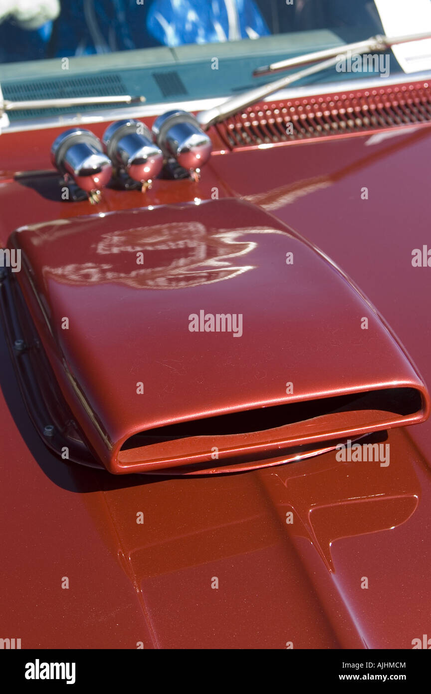 scoop and chrome instruments on car bonnet Stock Photo - Alamy