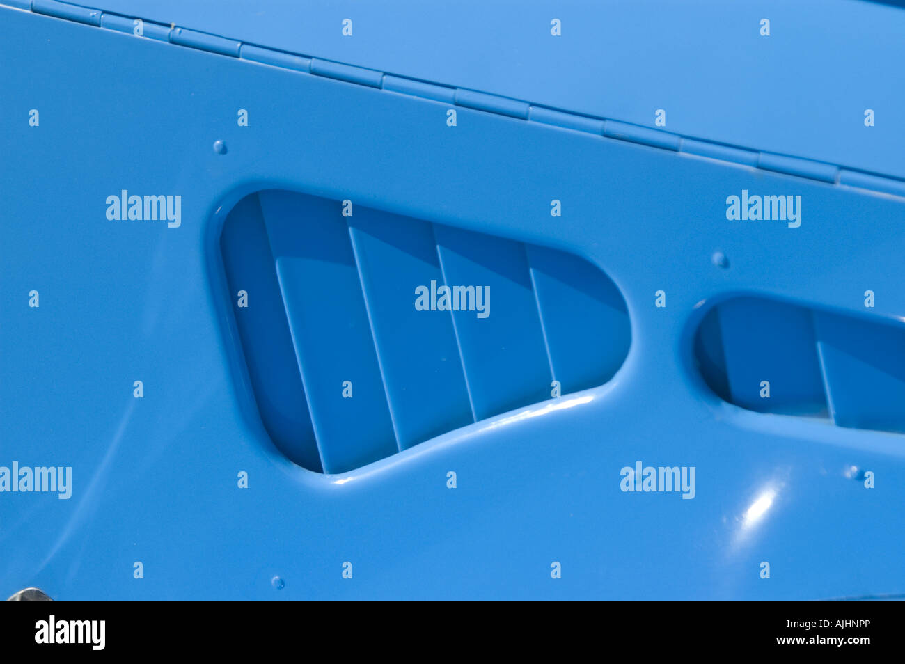 Blue vent on car bonnet Stock Photo - Alamy