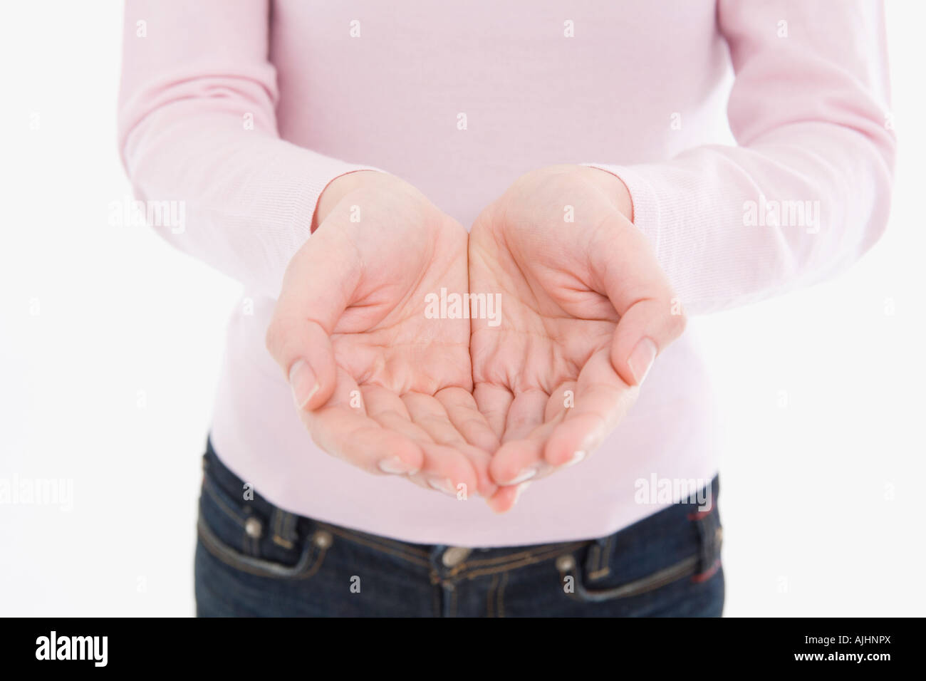 Woman cupping hands Stock Photo - Alamy