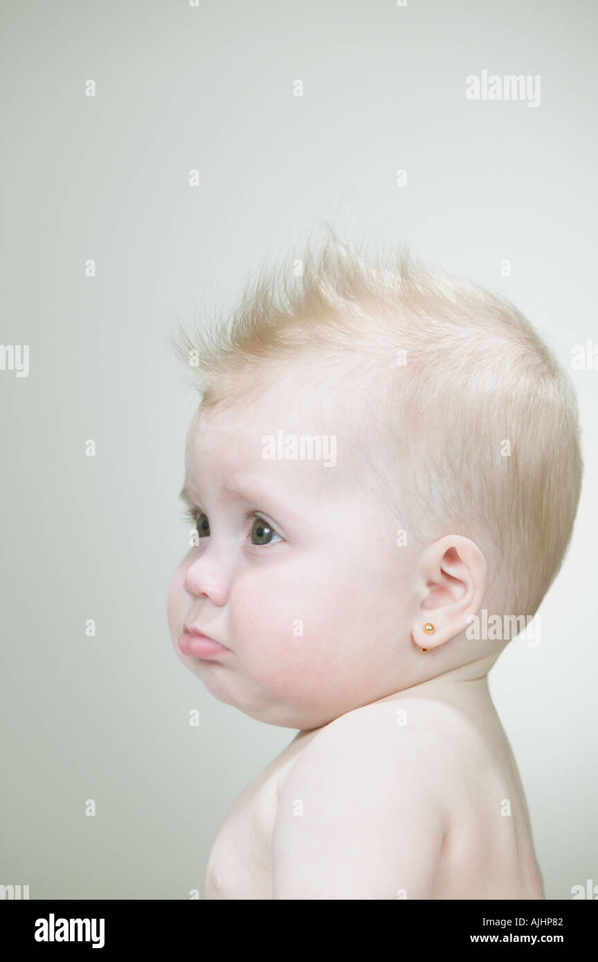 Baby girl with spiked hair Stock Photo - Alamy