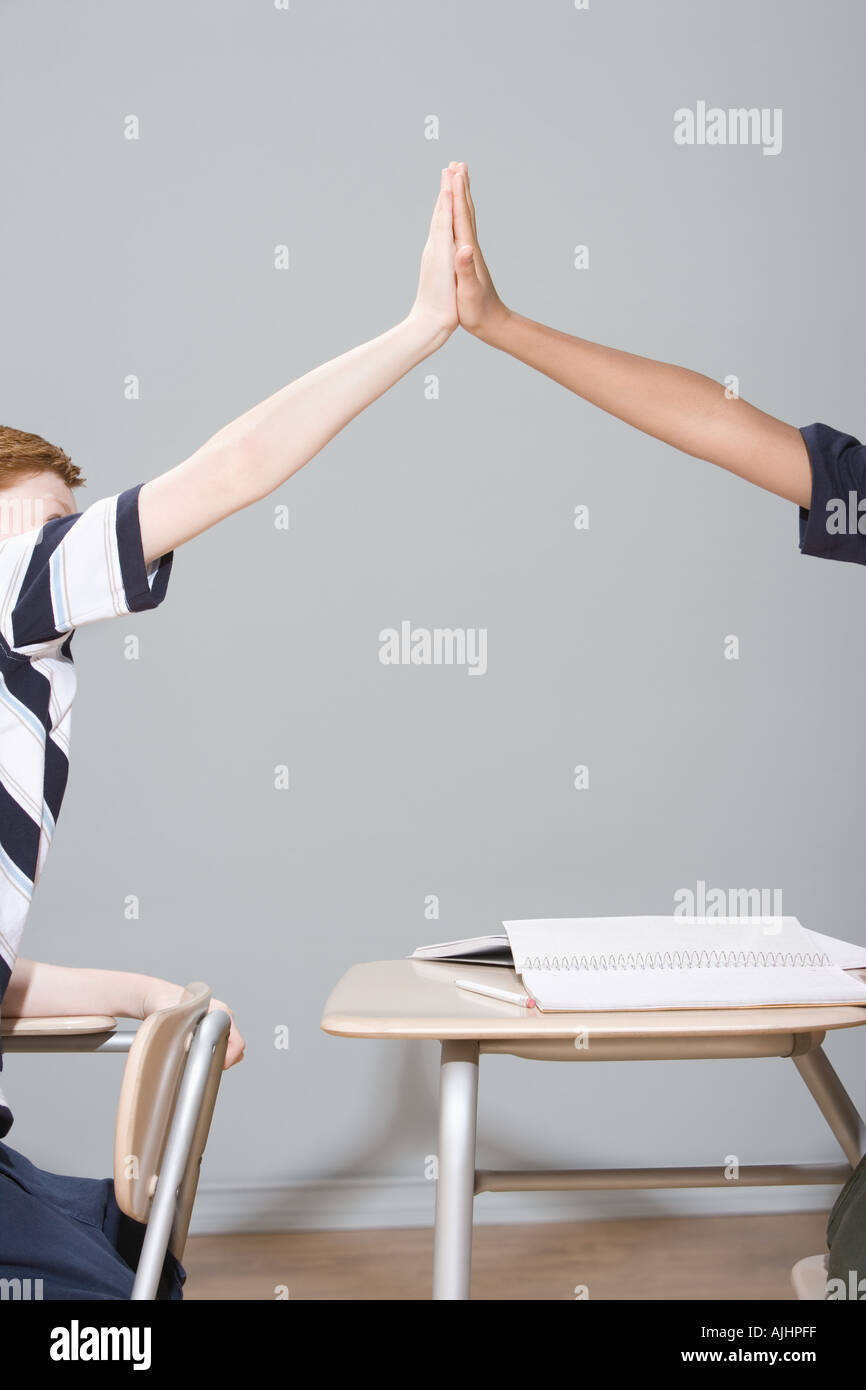 Two boys high five hi-res stock photography and images - Alamy