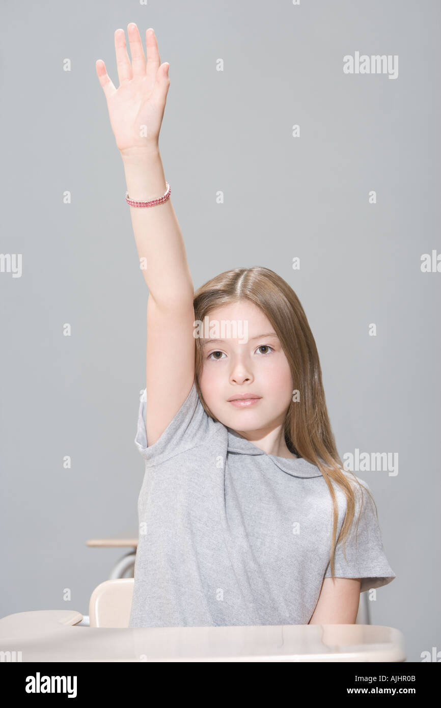 Girl raising her hand Stock Photo - Alamy Girl raising her hand Stock Photo - Alamy