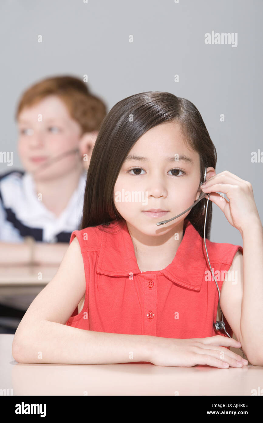 Children wearing headsets Stock Photo - Alamy