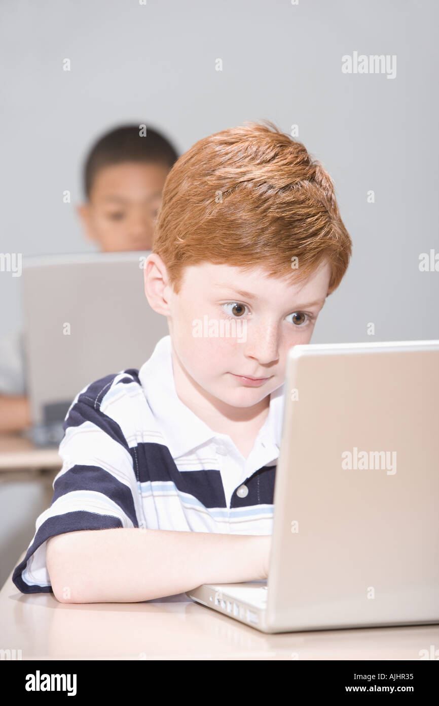 Boys using laptop computers Stock Photo - Alamy