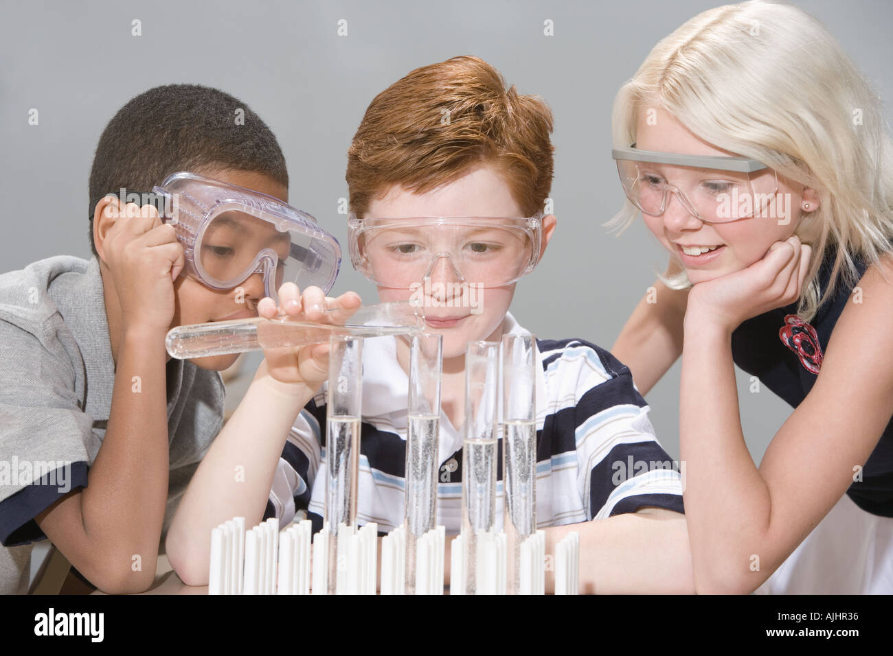 Children doing an experiment Stock Photo - Alamy