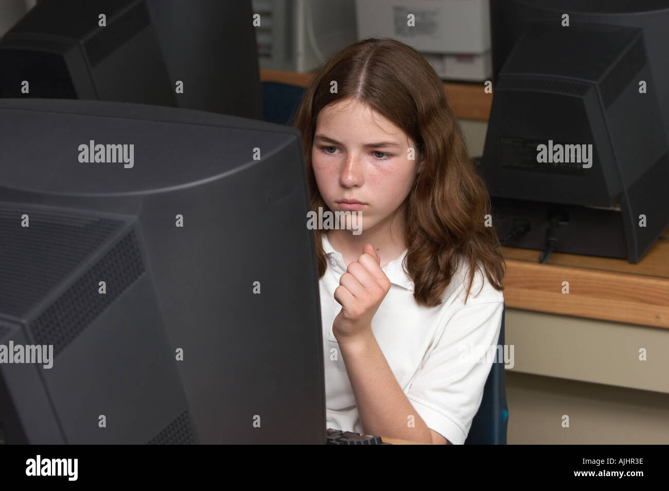 A female student working at a computer in a school computer lab Stock ...