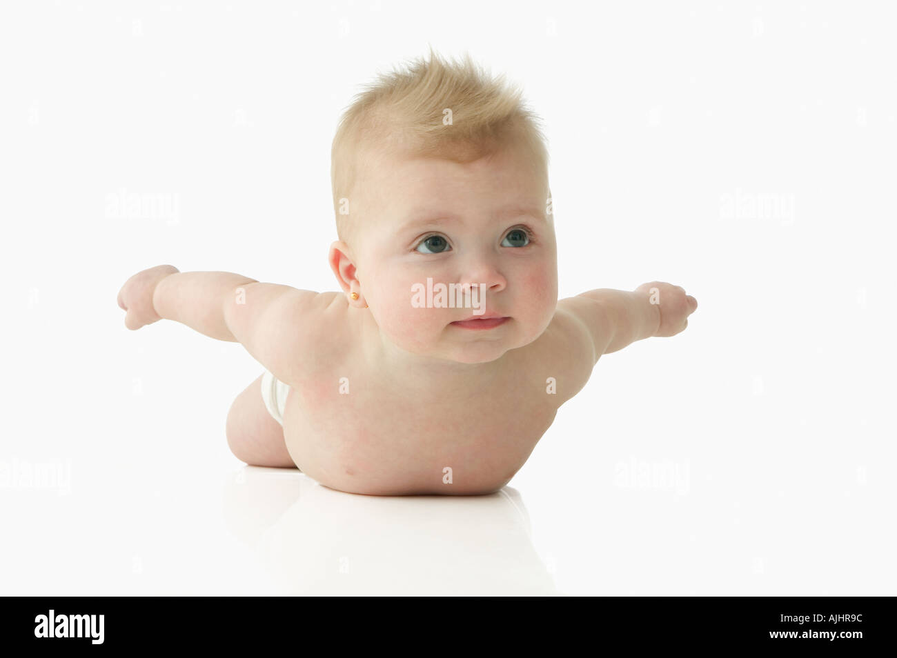 Baby lying on her front Stock Photo - Alamy