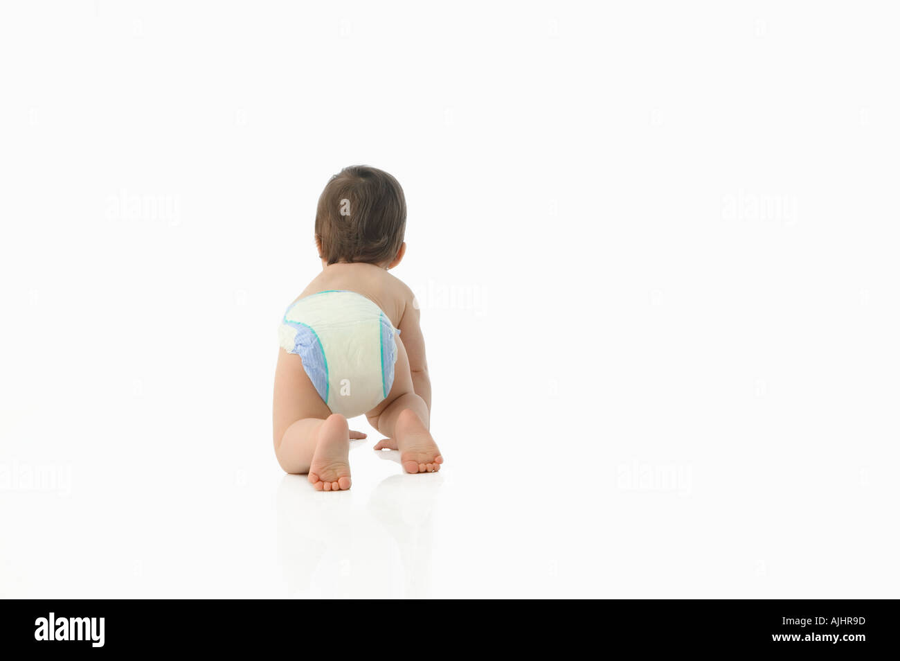Baby crawling away Stock Photo - Alamy