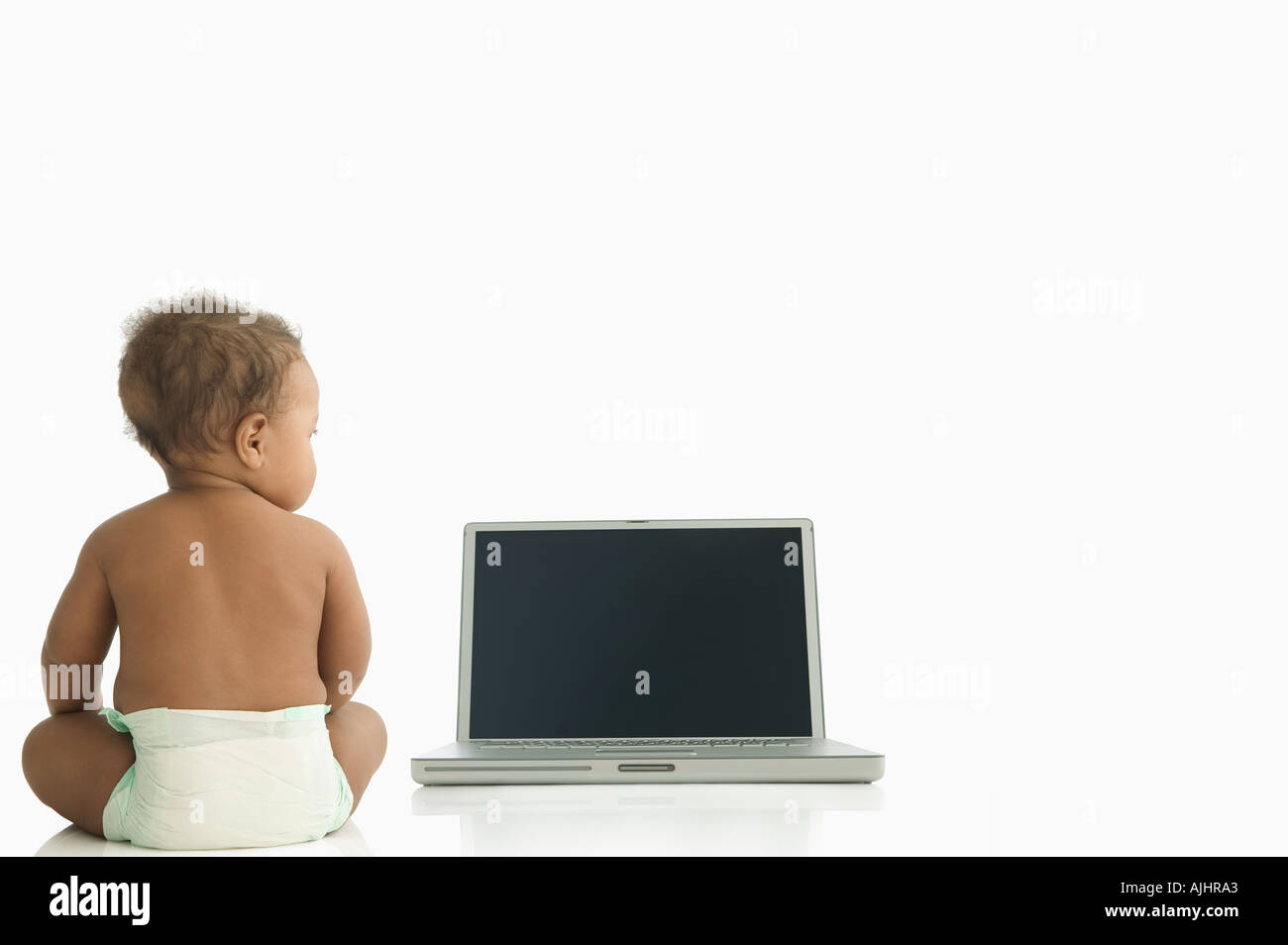 Baby with laptop computer Stock Photo - Alamy
