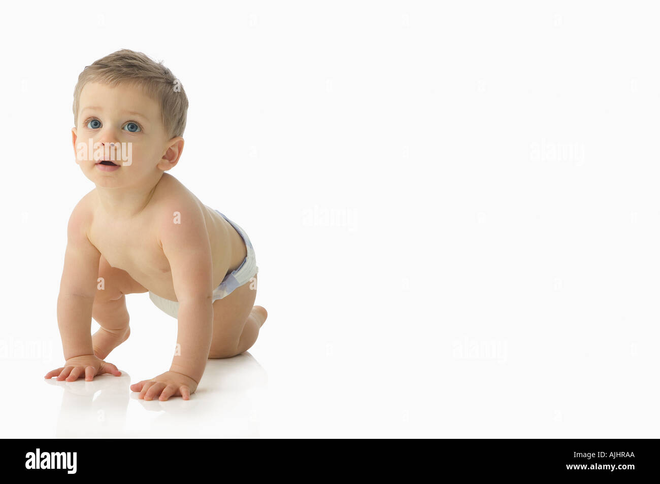 Baby boy crawling Stock Photo - Alamy