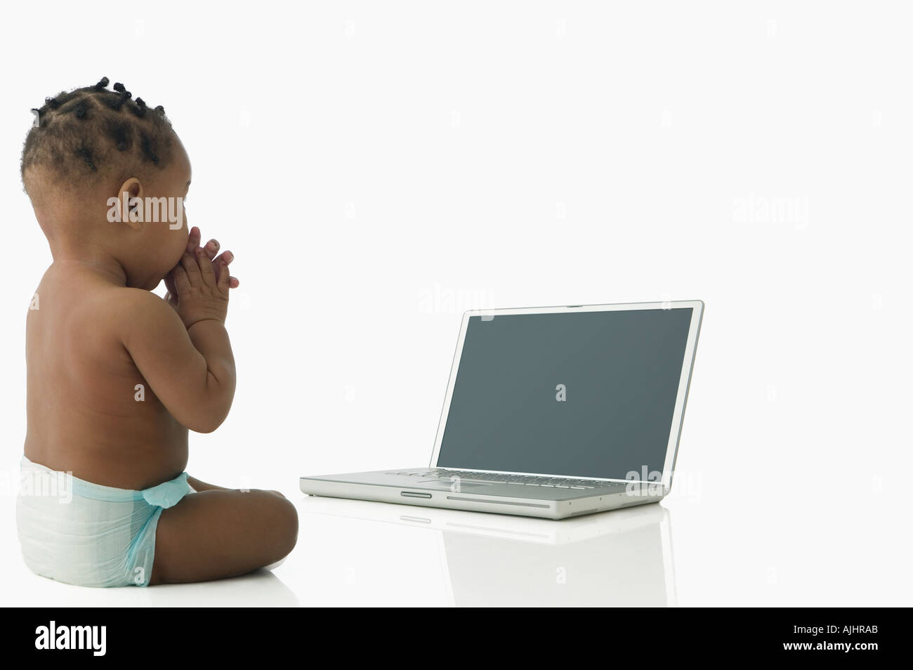 Baby with laptop computer Stock Photo - Alamy