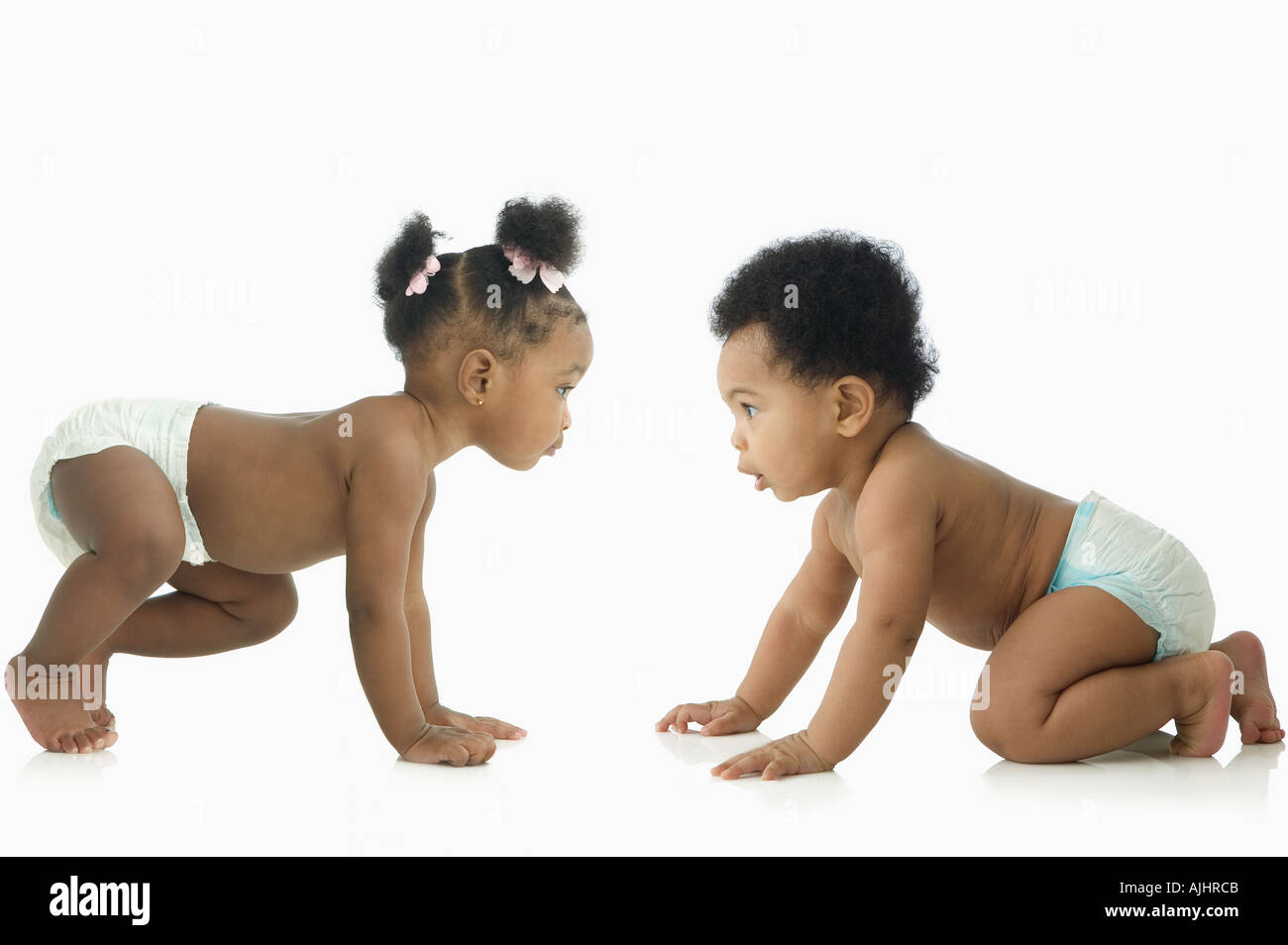 Babies face to face Stock Photo - Alamy