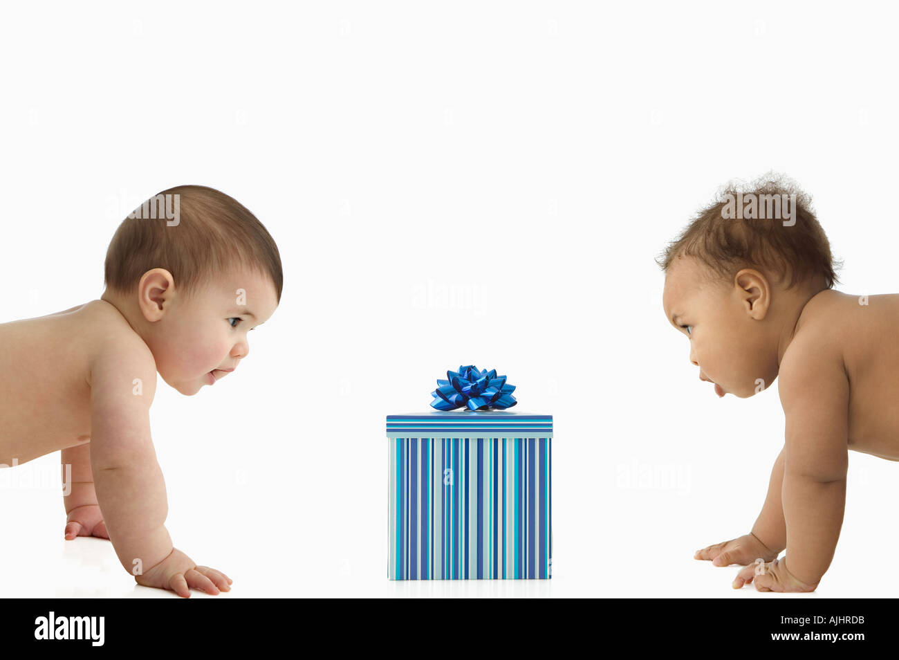 Two babies with a gift box Stock Photo - Alamy
