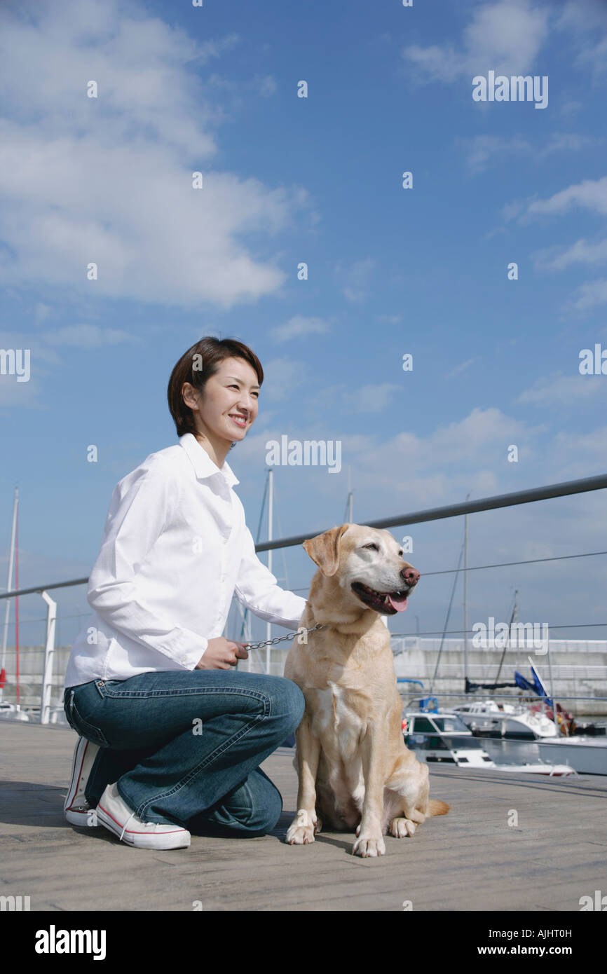 Young woman and Labrador retriever Stock Photo - Alamy