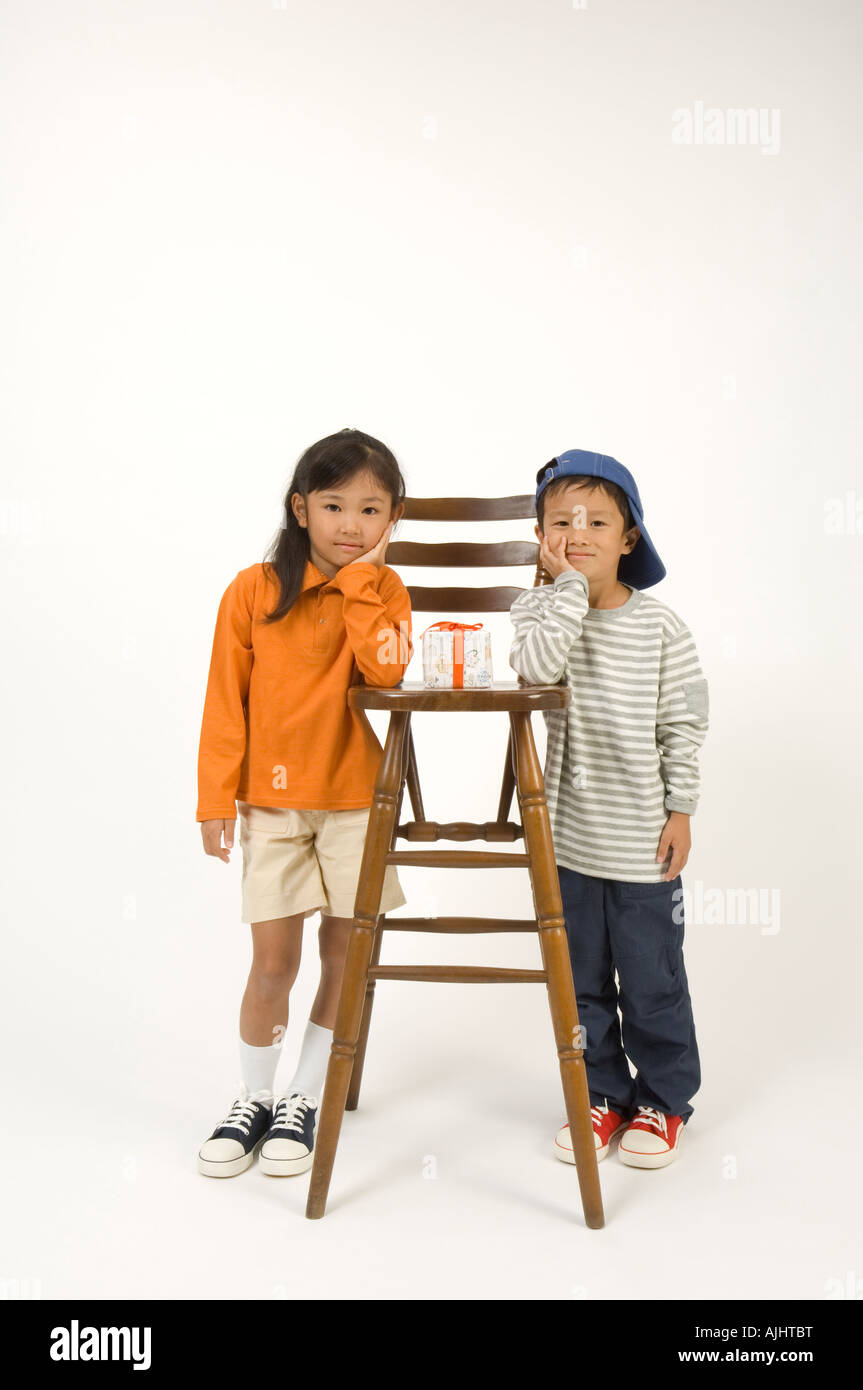 Two elementary age children standing Stock Photo - Alamy