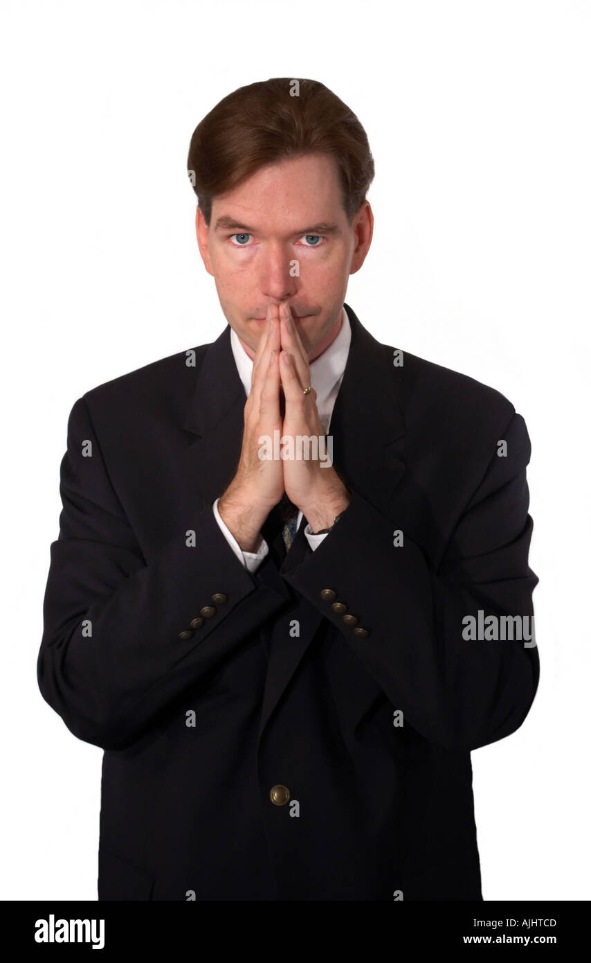 A business man with hands closed Stock Photo - Alamy