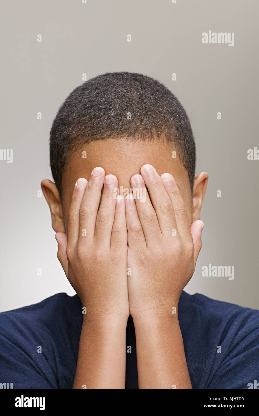 Crying boy face covered hi-res stock photography and images - Alamy