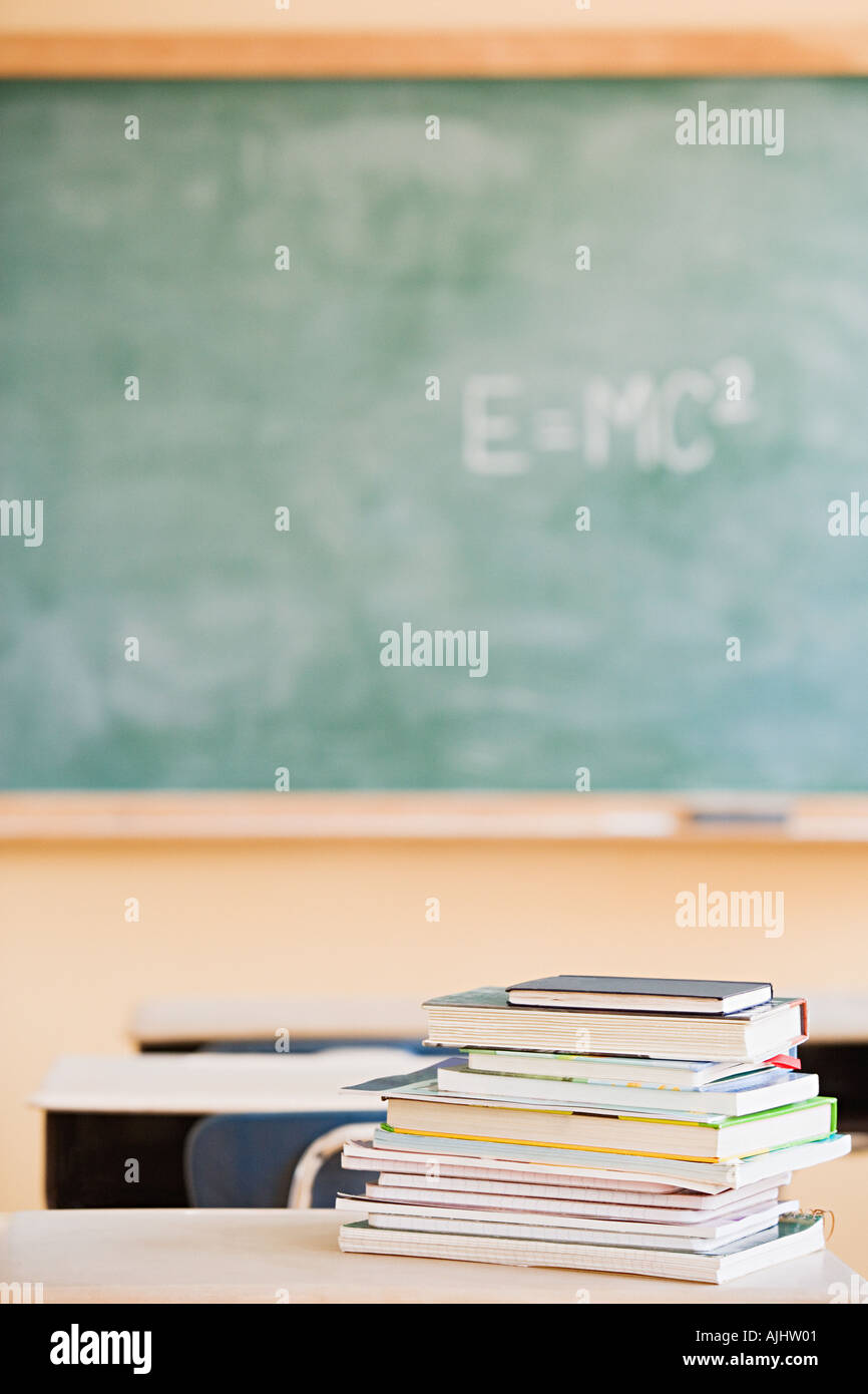 Textbooks and blackboard in classroom Stock Photo - Alamy