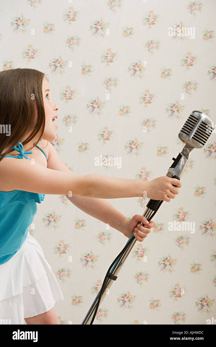 Girl with microphone Stock Photo - Alamy